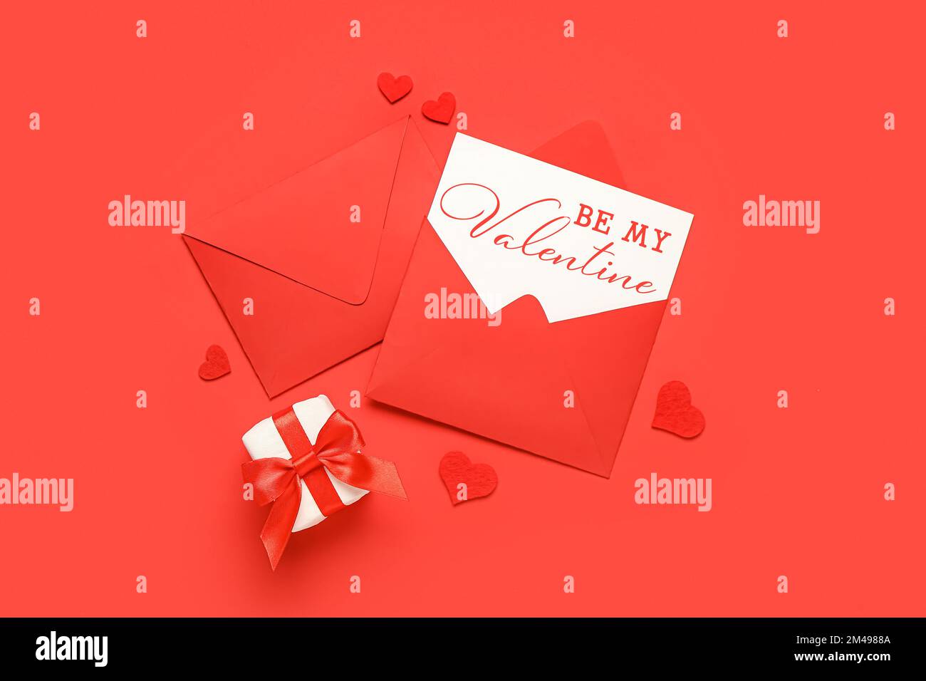 Envelopes, card for Valentine's Day and gift on red background Stock ...