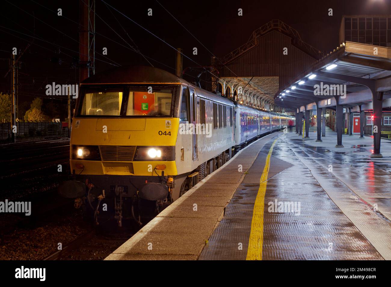 The lowland Caledonian sleeper train at Preston railway station hauled by a Freightliner class ...