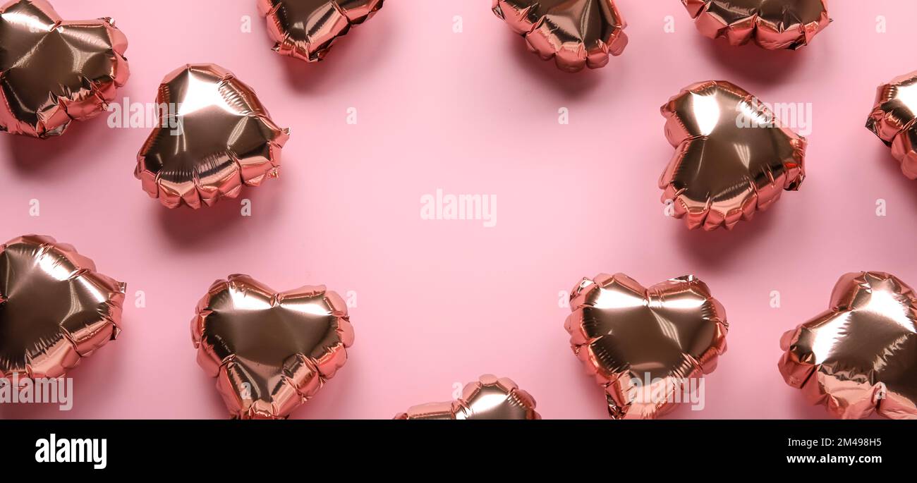 Frame made of heart-shaped balloons for Valentine's day on pink ...