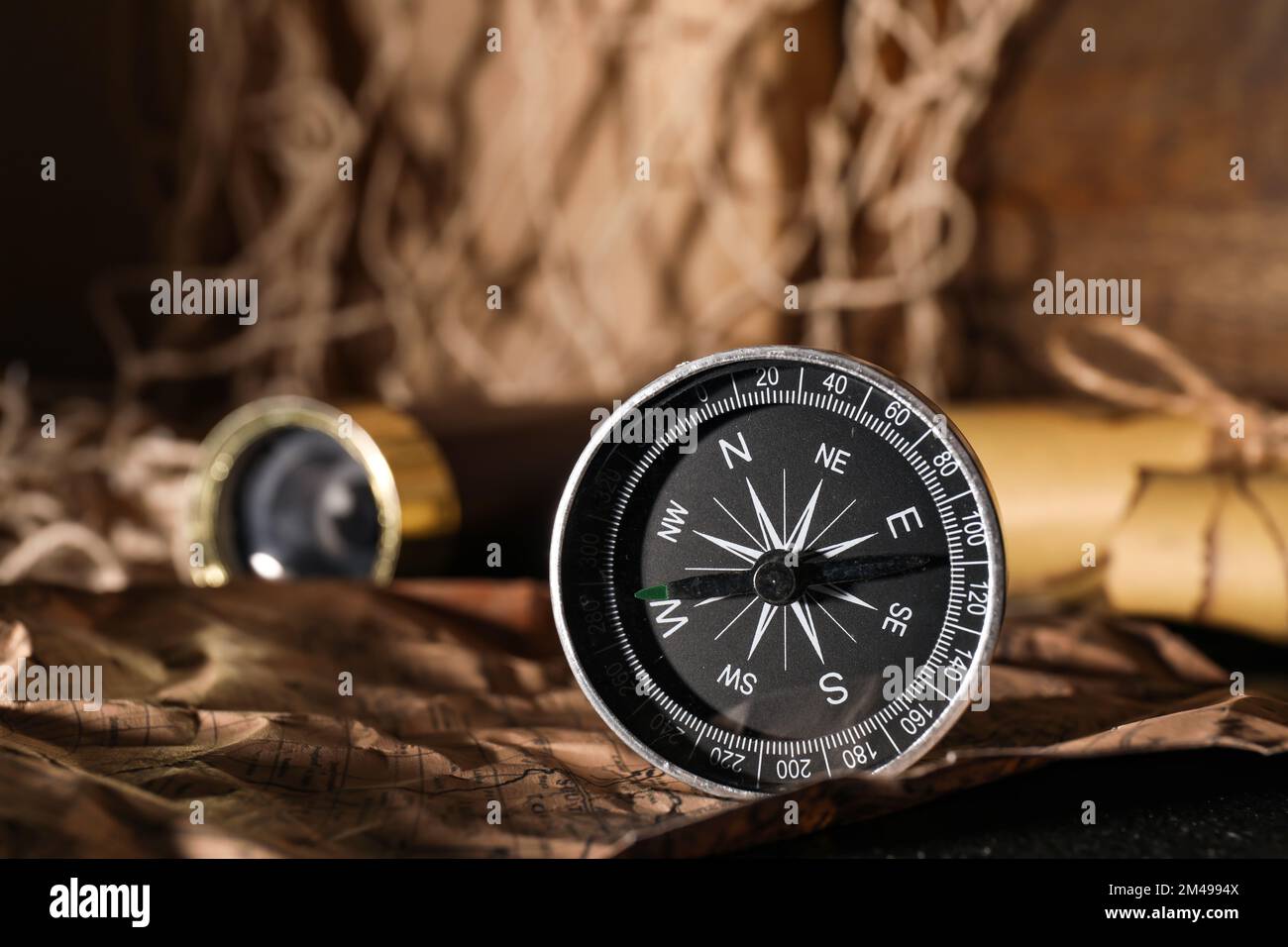 Black compass on world map, closeup Stock Photo - Alamy