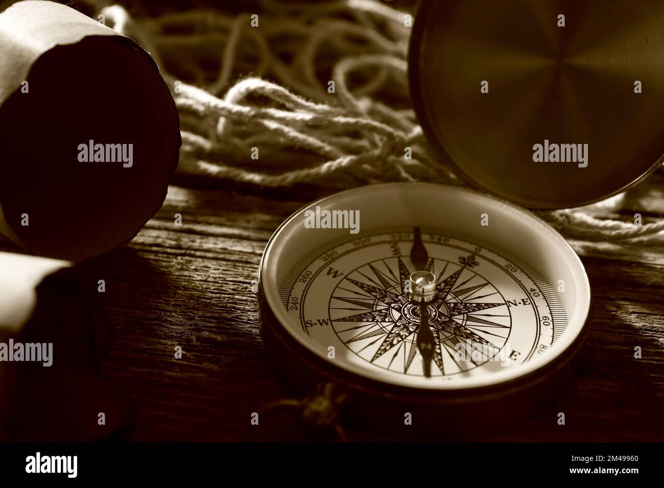 Compass and maps on dark wooden background, closeup Stock Photo - Alamy