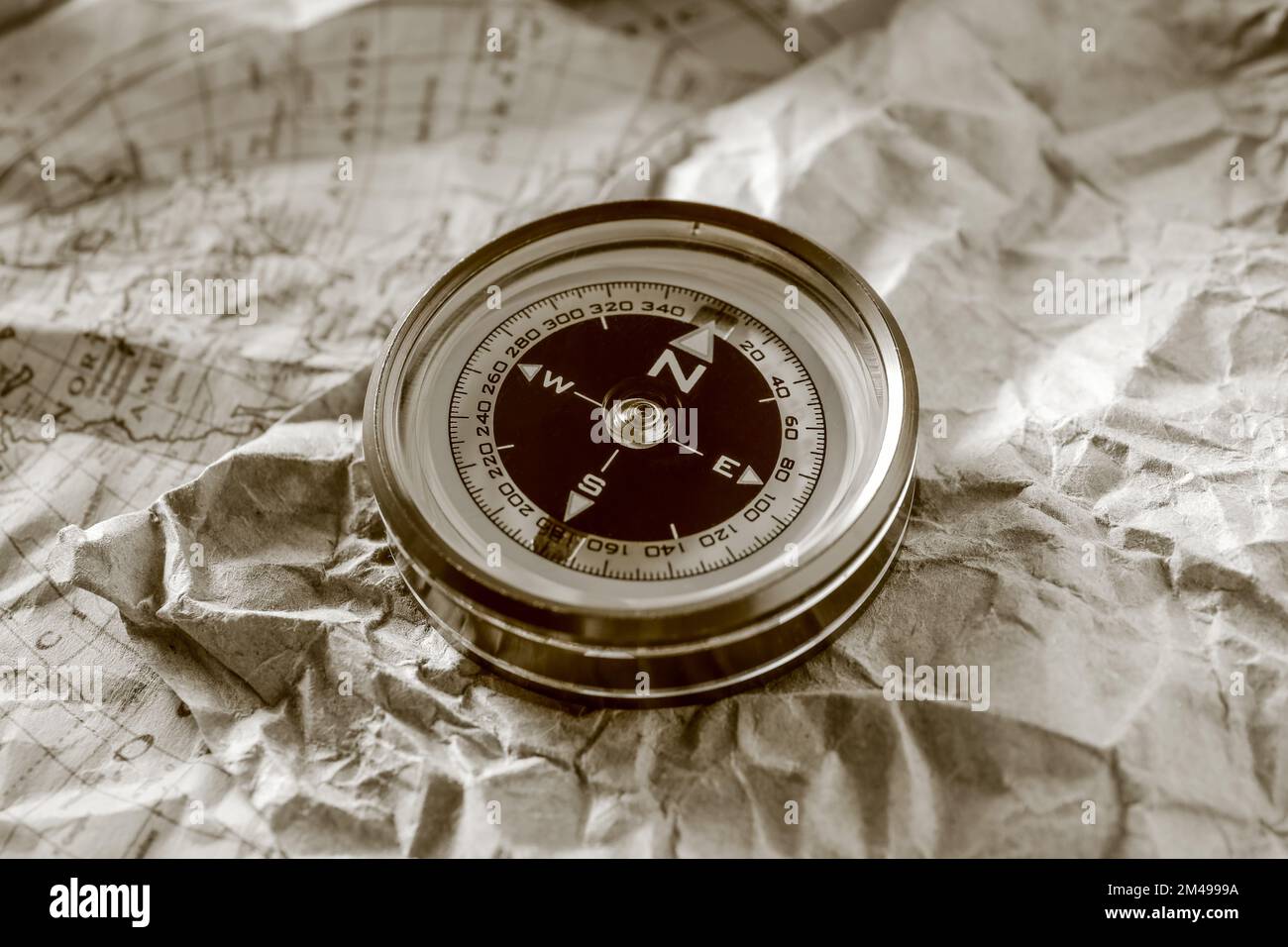 Closeup view of vintage compass on world map Stock Photo - Alamy