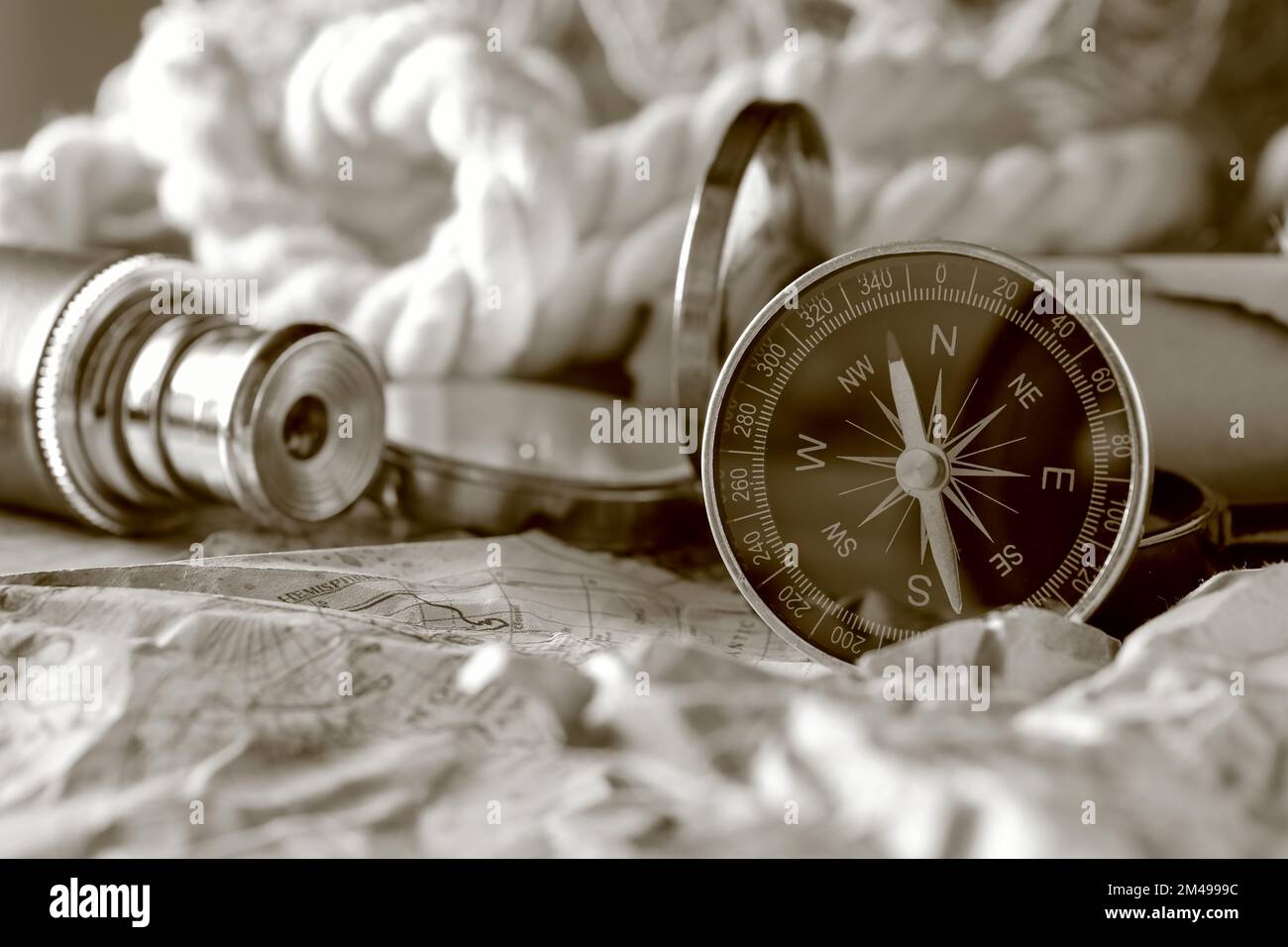Vintage compass on crumpled world map, closeup Stock Photo - Alamy