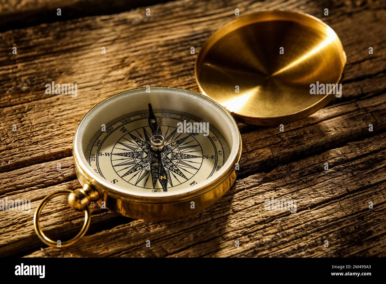 Vintage compass on wooden surface Stock Photo - Alamy