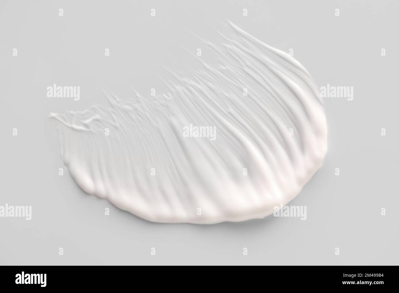 Smear of moisturising facial cream on grey background Stock Photo - Alamy