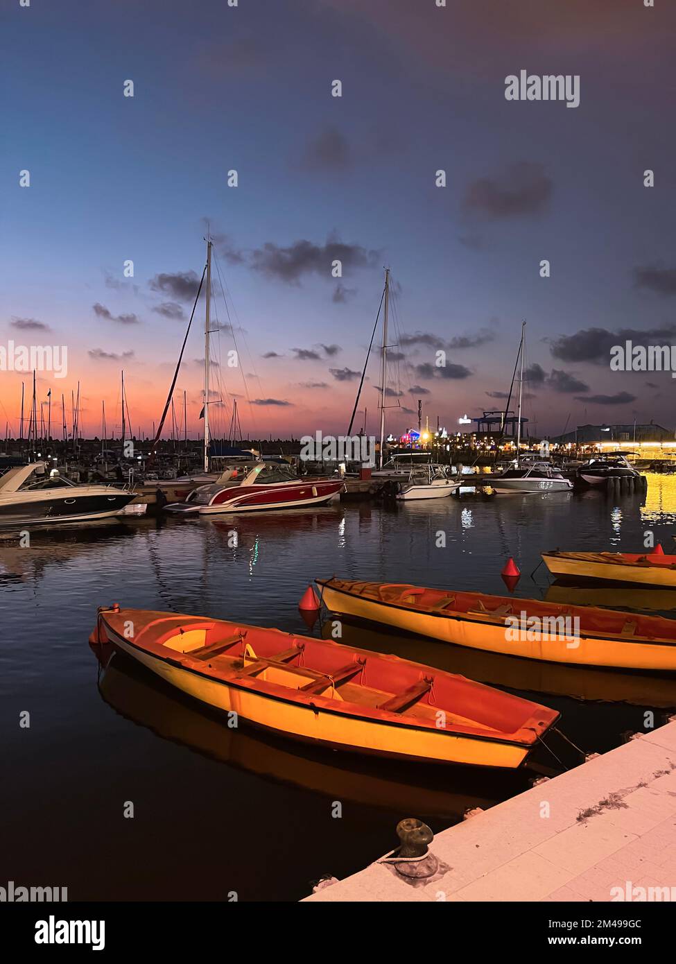 Small yacht in dock on warm evening Stock Photo - Alamy
