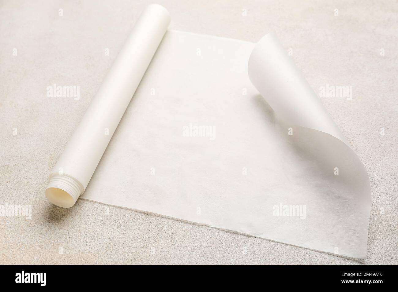 Baking paper on light background Stock Photo - Alamy
