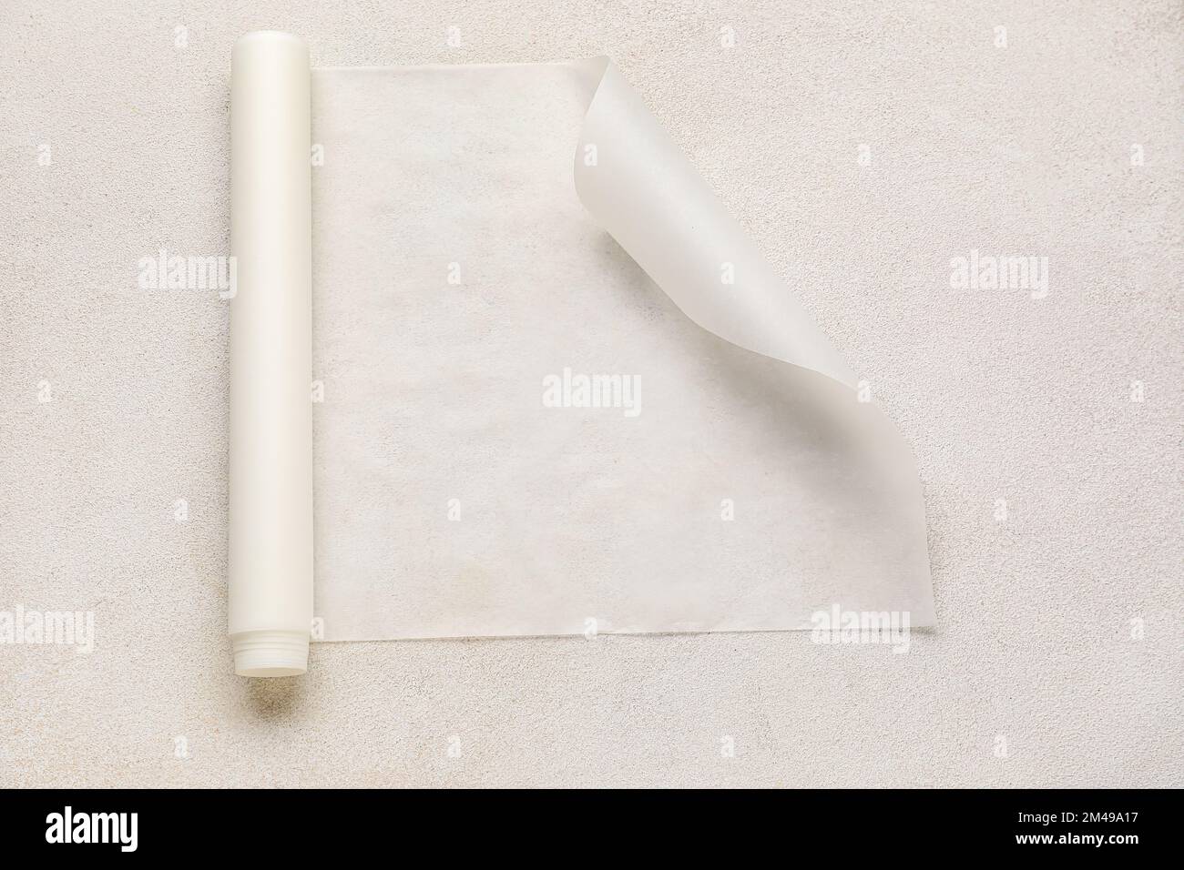 Baking paper on light background Stock Photo - Alamy