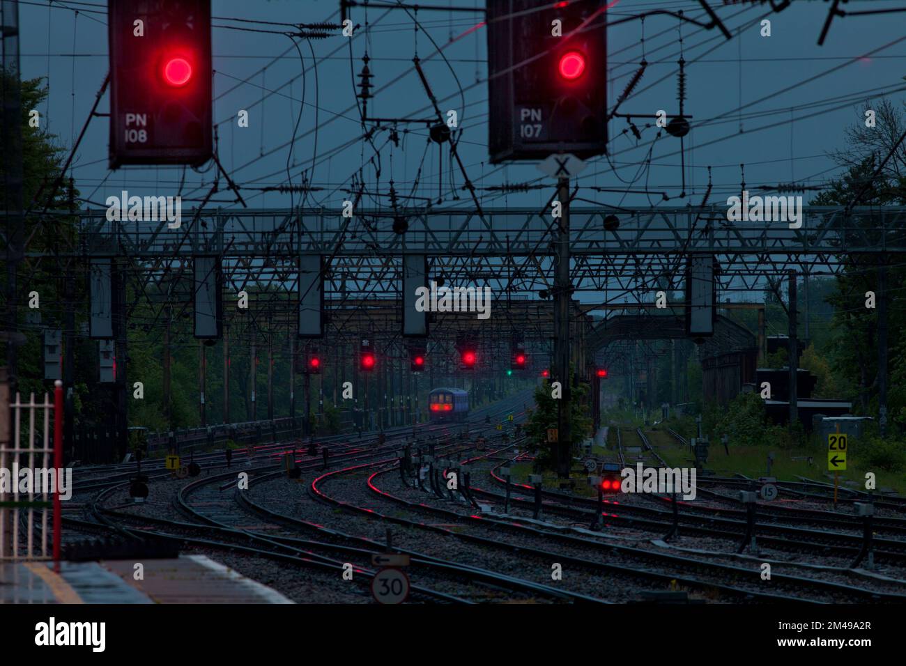 Surrounded by red signals a Northern Rail class 319 electric train ...