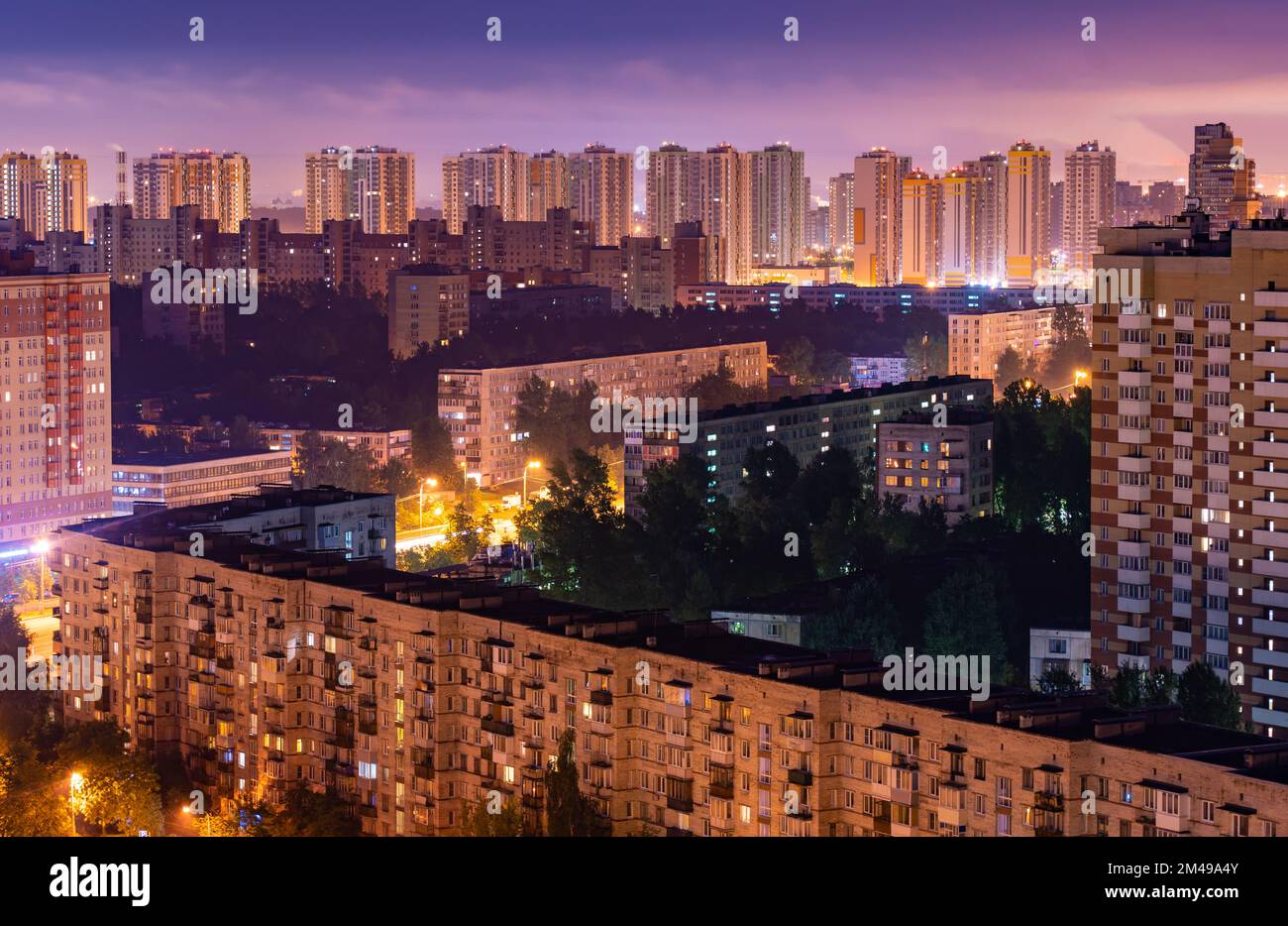 Night colorful windows lights of the high-rise residential building in ...
