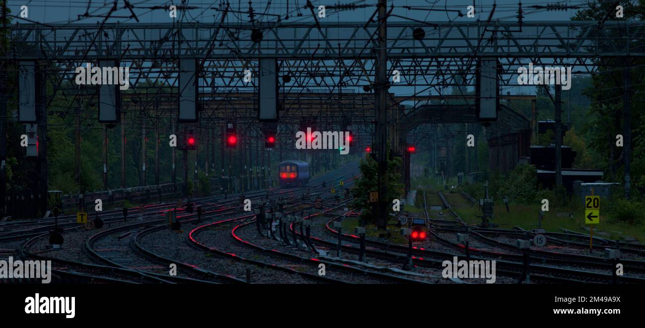 Surrounded by red signals a Northern Rail class 319 electric train ...
