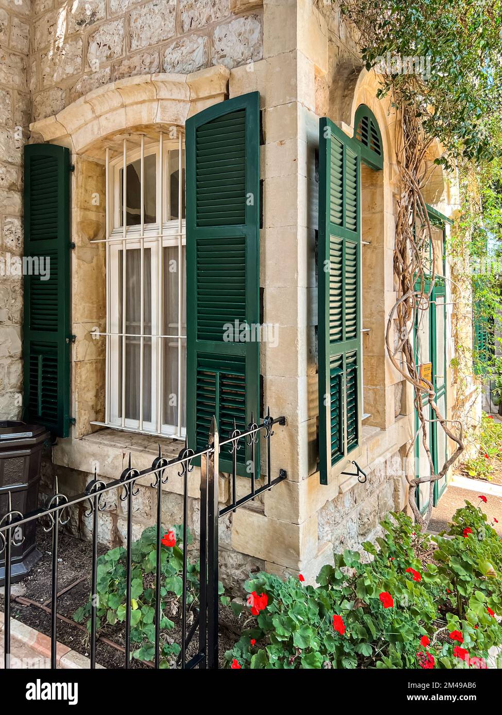 Stone house and flower beds under windows Stock Photo - Alamy