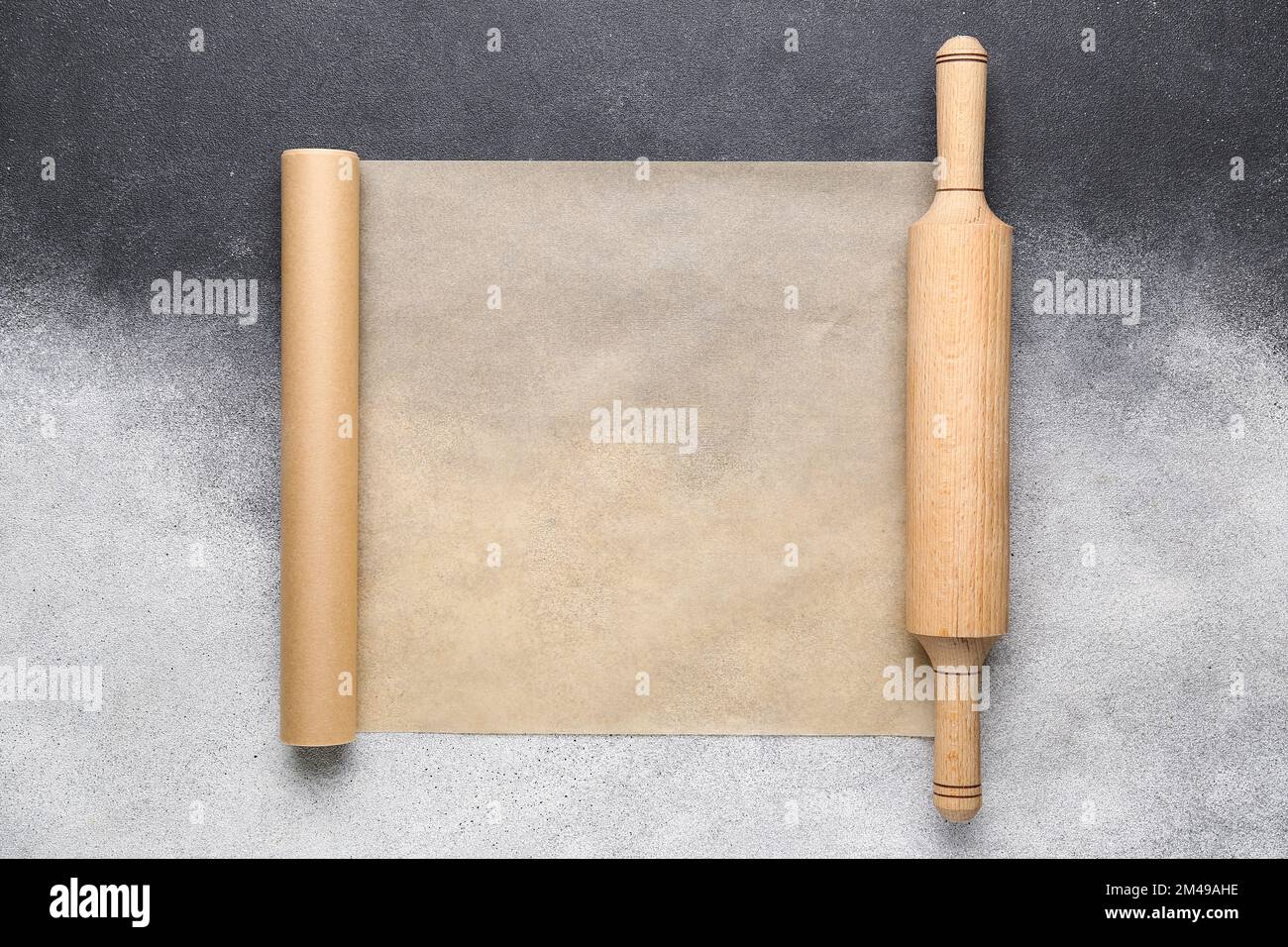 Roll of baking paper and rolling pink on black and white background ...