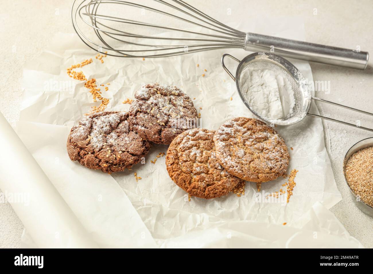 Baking paper with delicious cookies on light background, closeup Stock ...