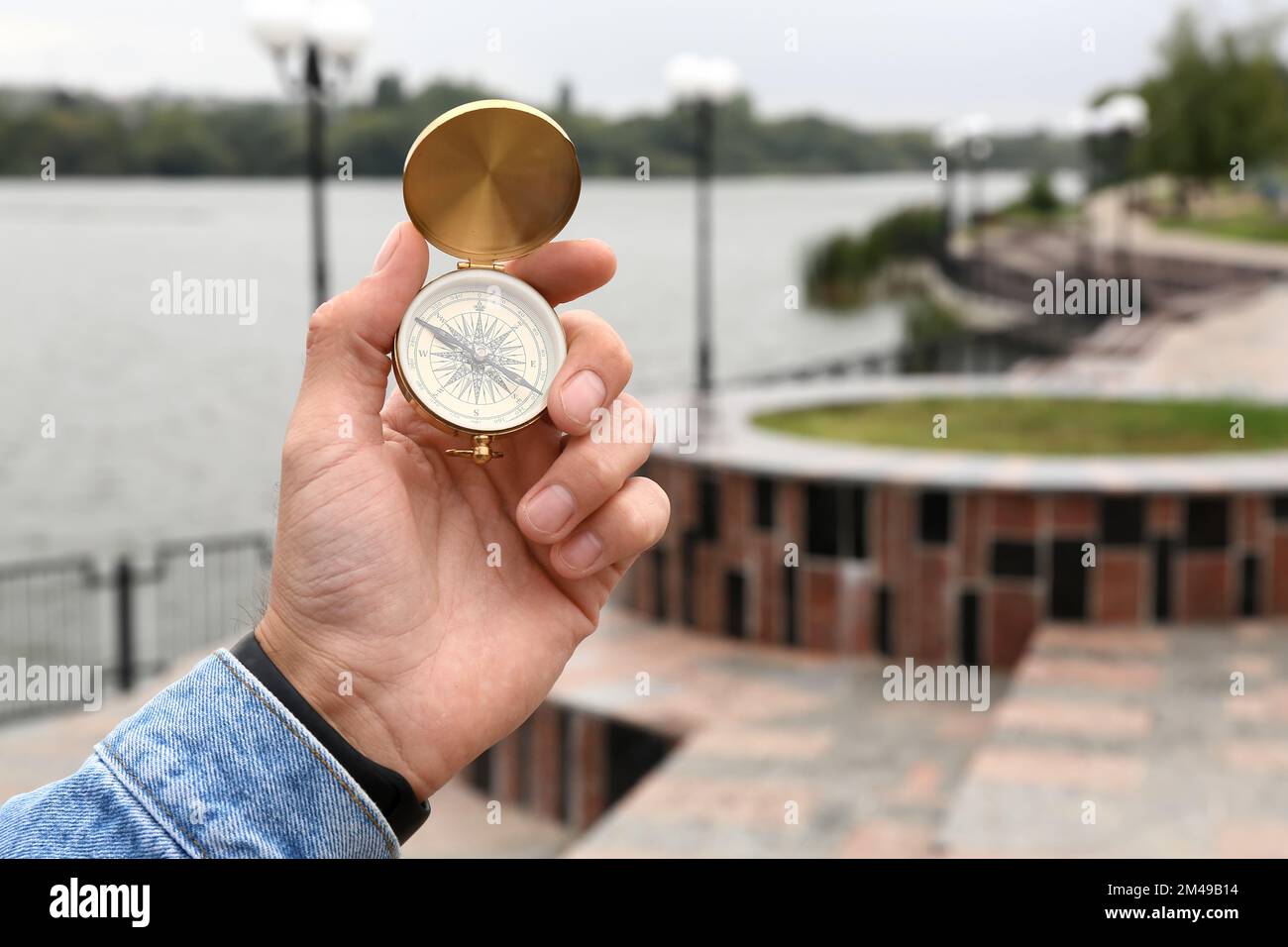 Man golden compass in hi-res stock photography and images - Alamy