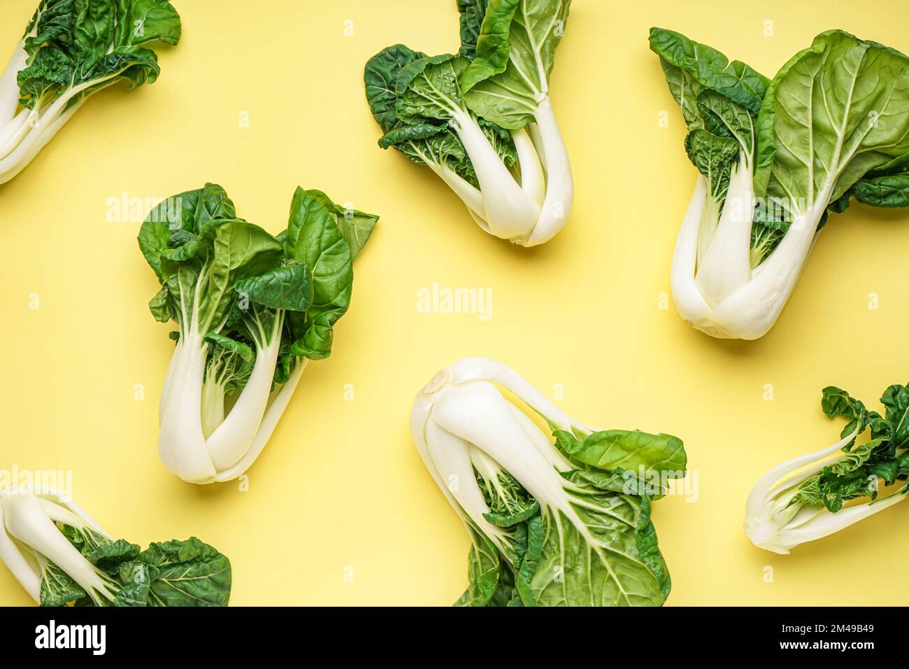 Fresh pak choi cabbages on yellow background Stock Photo - Alamy