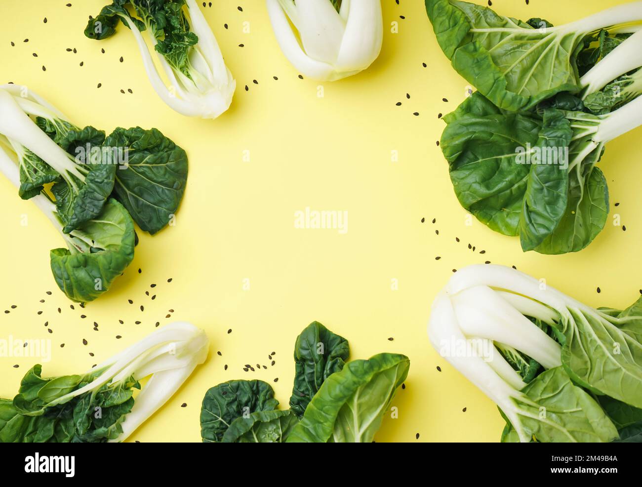 Frame made of fresh pak choi cabbage on yellow background Stock Photo ...