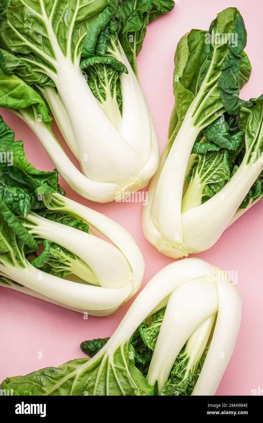 Fresh pak choi cabbages on pink background, closeup Stock Photo - Alamy