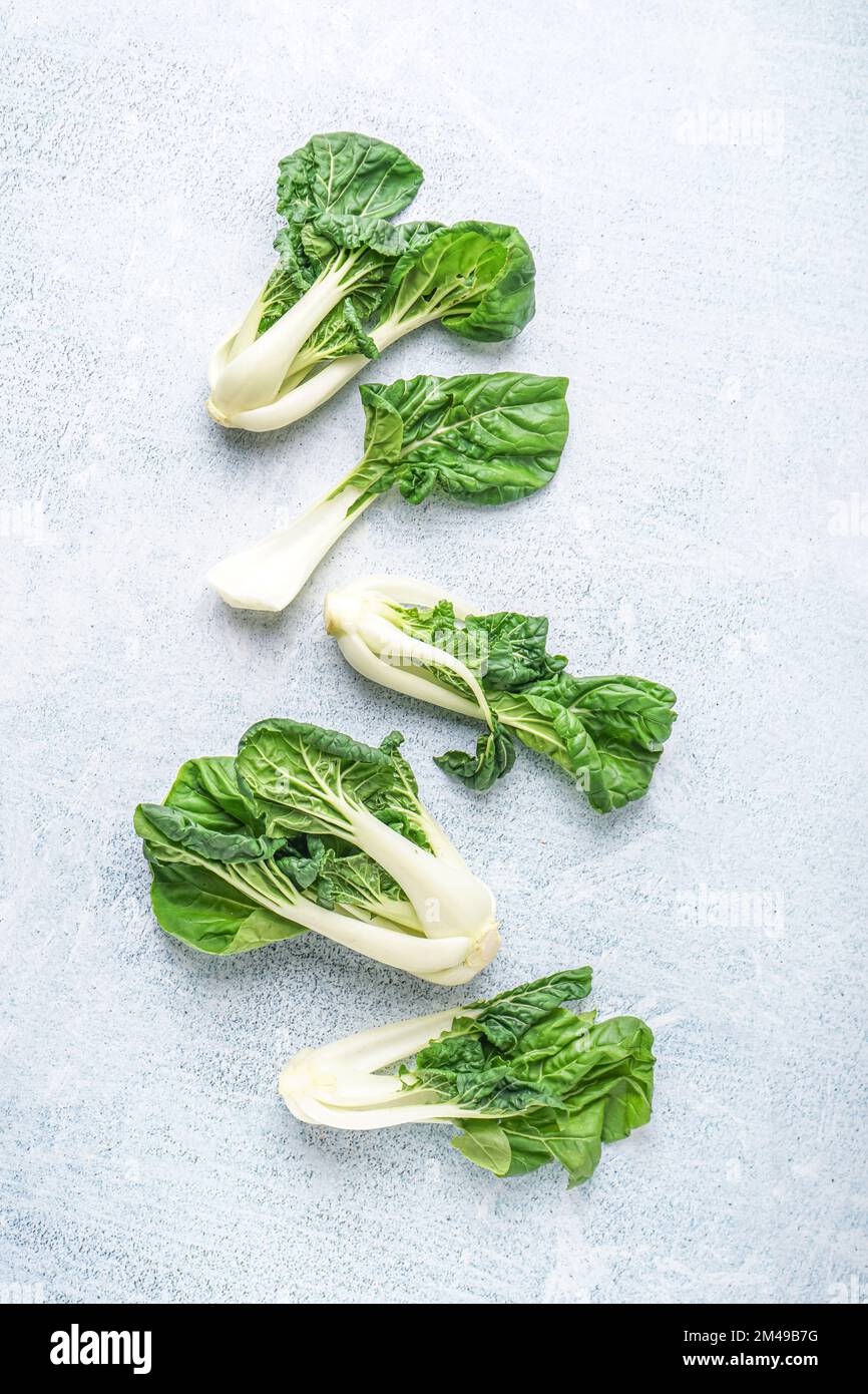Fresh green pak choi cabbage on light background Stock Photo - Alamy