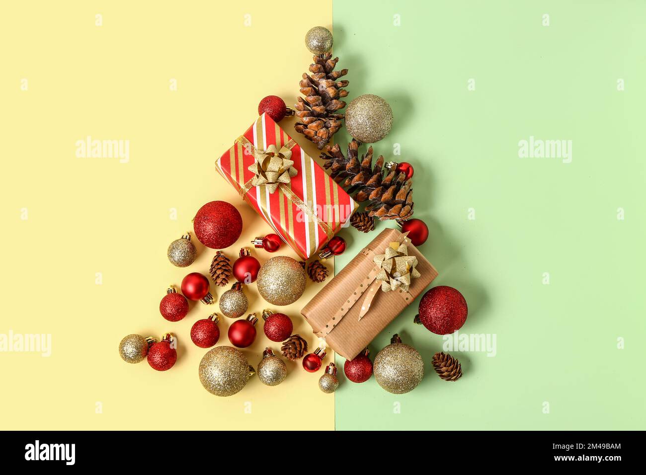 Christmas tree made of gifts and decorations on color background Stock ...