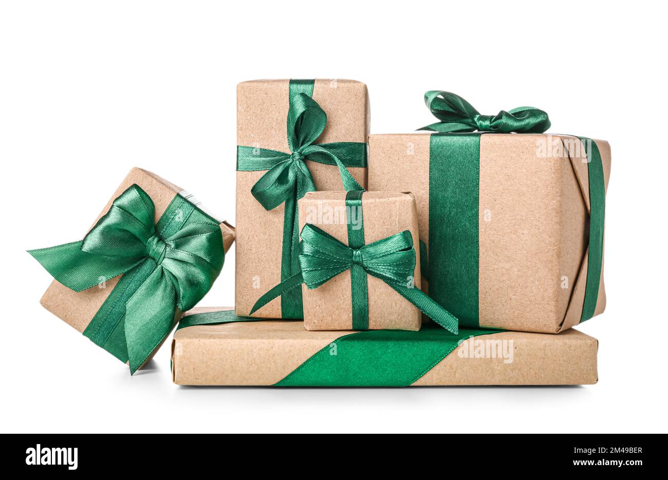 Stack of different gift boxes tied with green ribbon on white ...