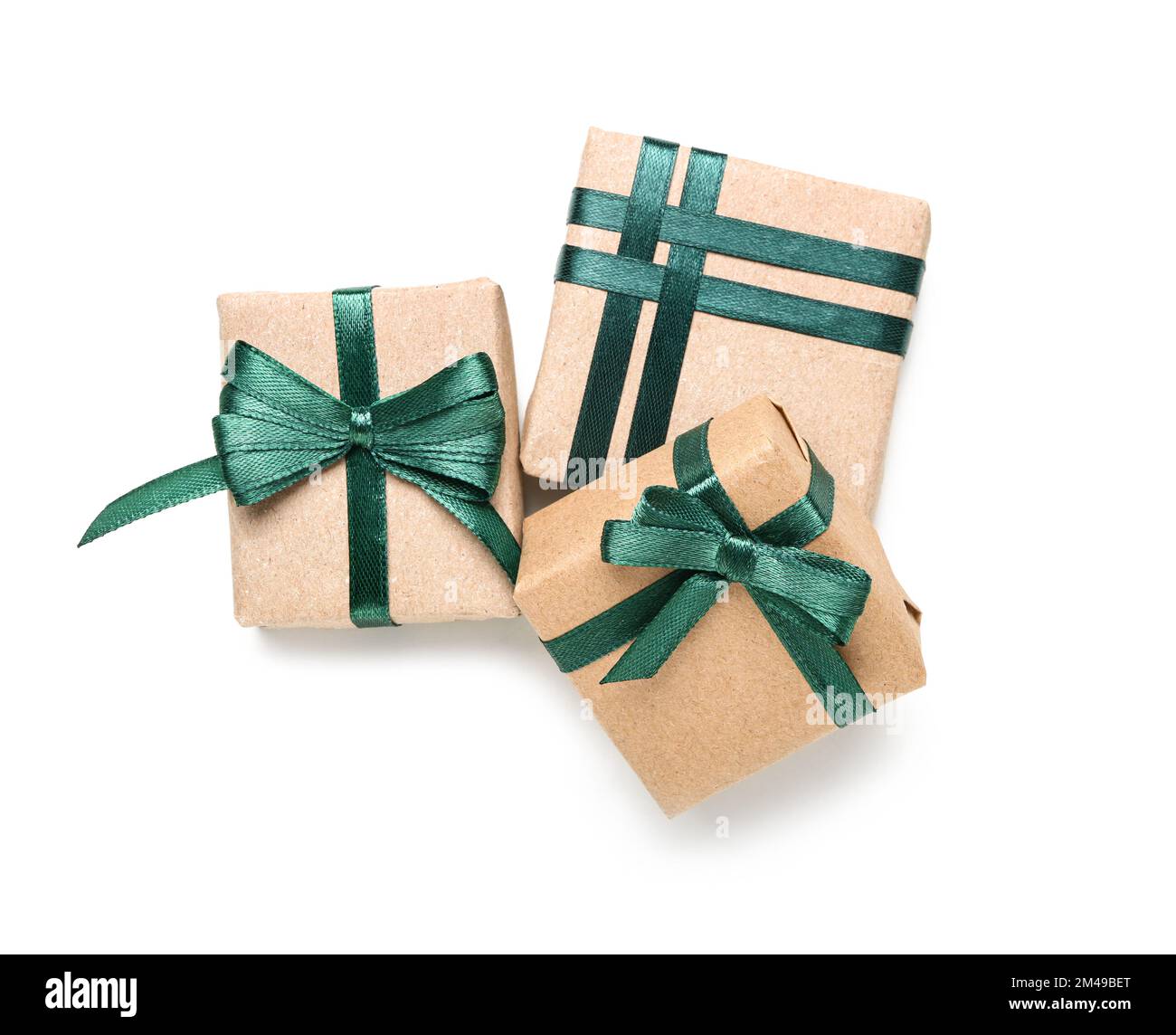 Gift boxes tied with green ribbon on white background Stock Photo - Alamy