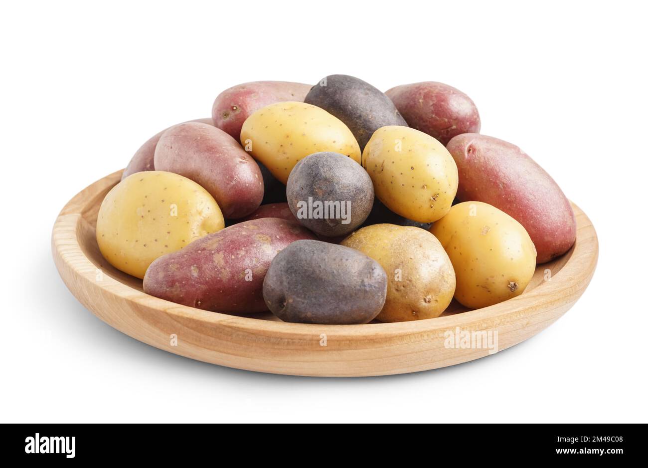 Wooden plate with different types of raw potatoes on white background ...