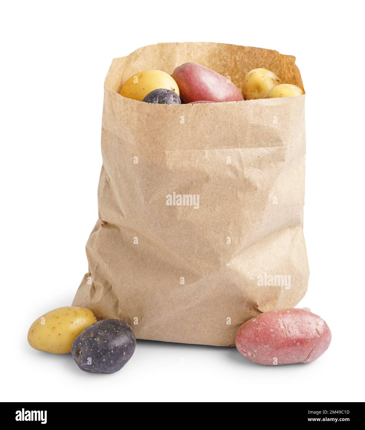 Paper bag with different types of raw potatoes on white background ...