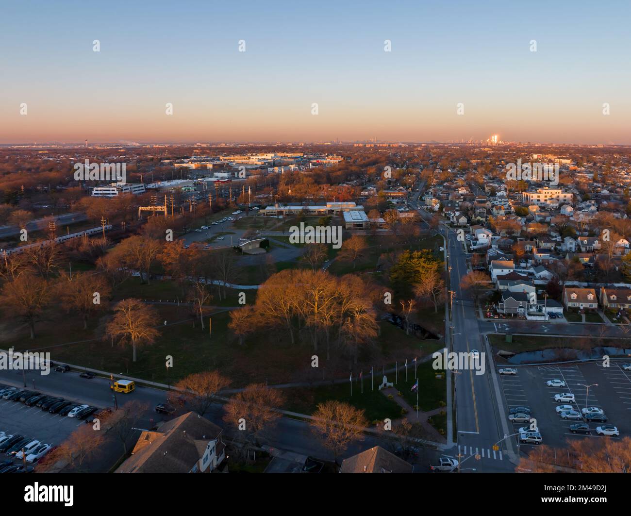 An aerial view of a beautiful sunset sky over a suburban neighborhood ...