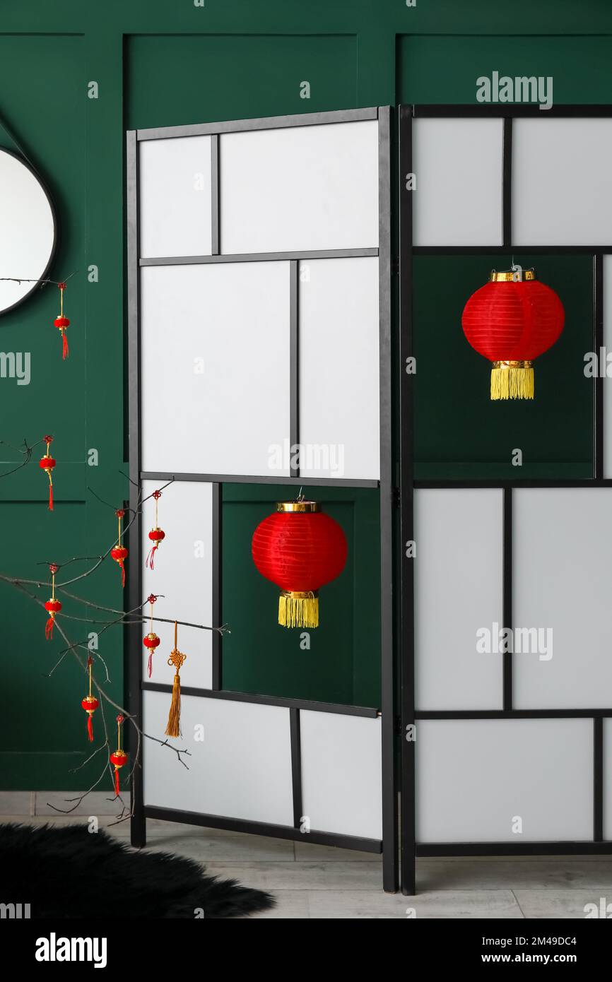 Folding screen with lanterns for Chinese New Year celebration in room ...