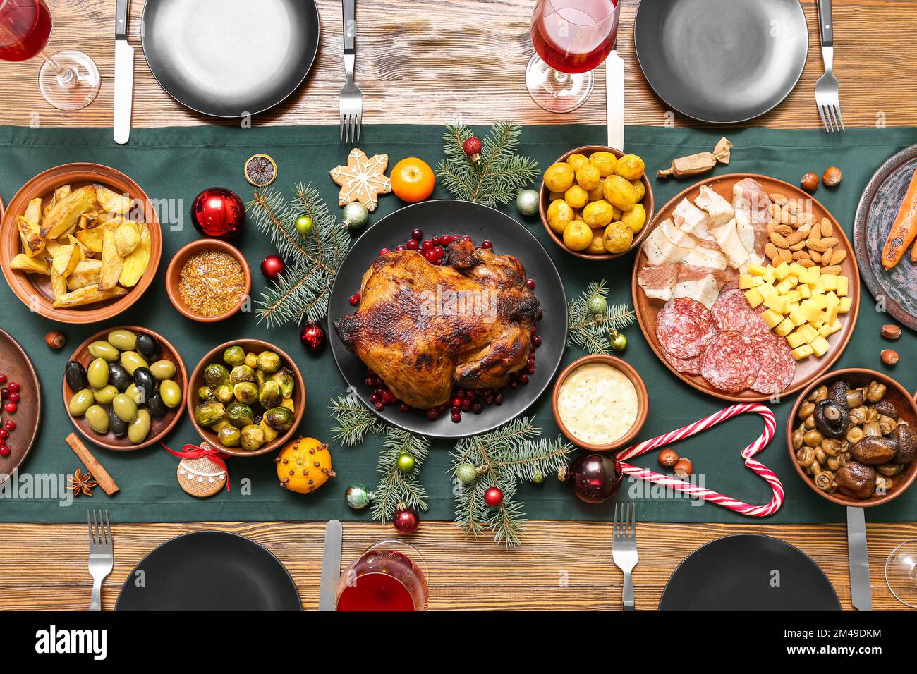 Tasty food with Christmas balls and fir branches on wooden table, top ...