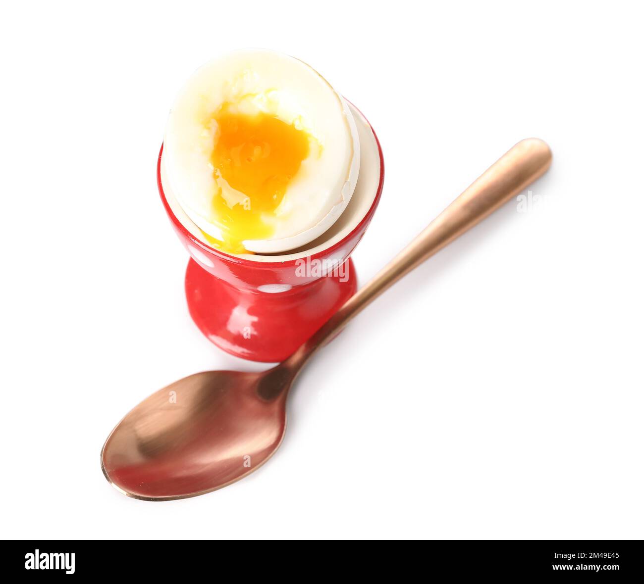 Cup with soft boiled egg and spoon on white background Stock Photo - Alamy