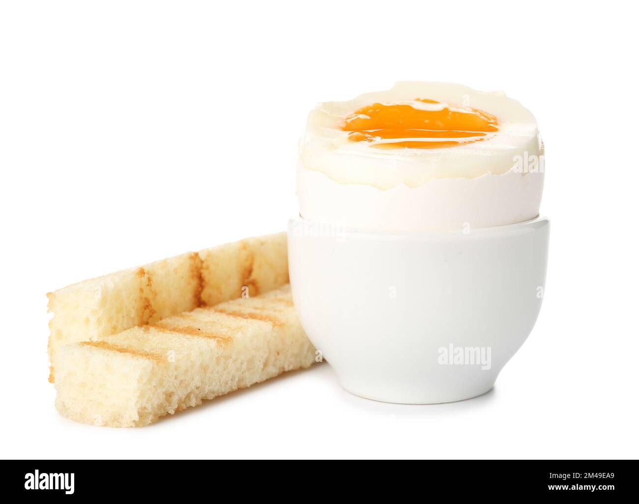 Holder with soft boiled egg and toasted bread on white background Stock ...
