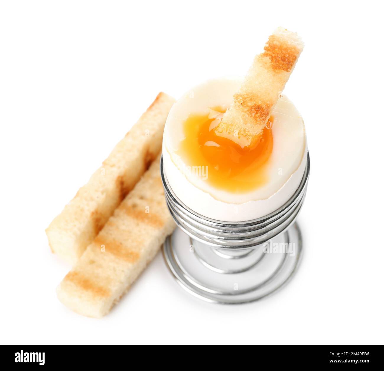 Holder with soft boiled egg and toasted bread on white background Stock ...