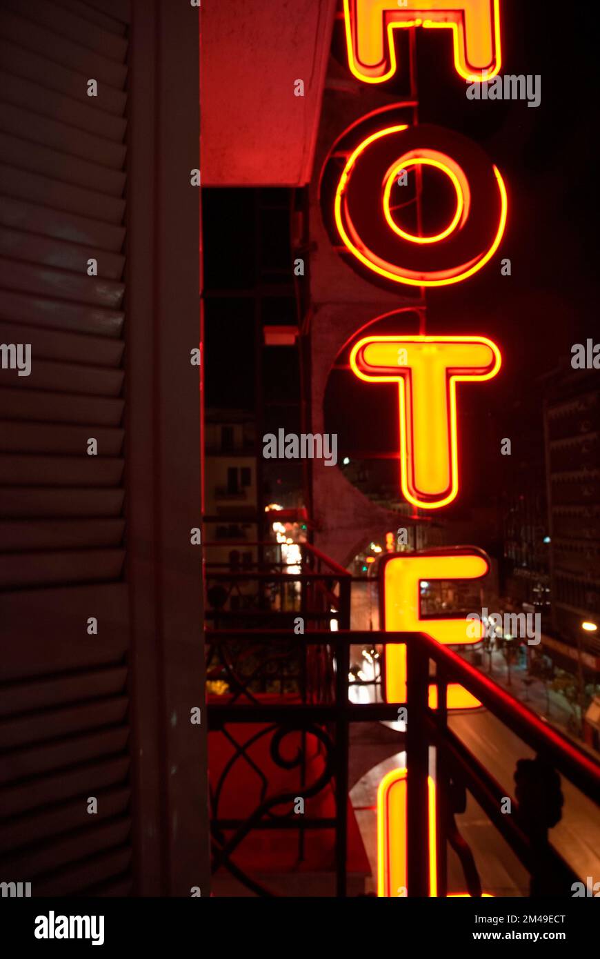 Hotel sign made of neon lights at night Stock Photo - Alamy