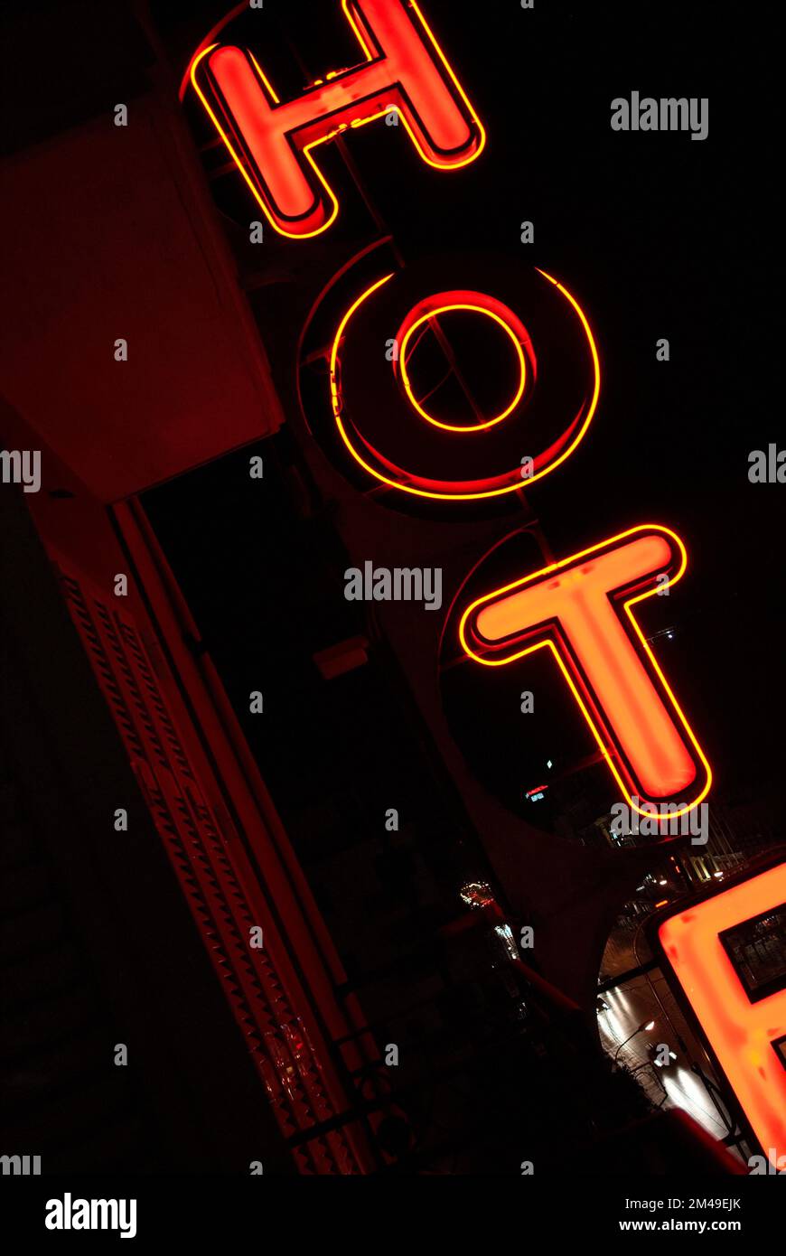 Hotel sign made of neon lights at night Stock Photo - Alamy