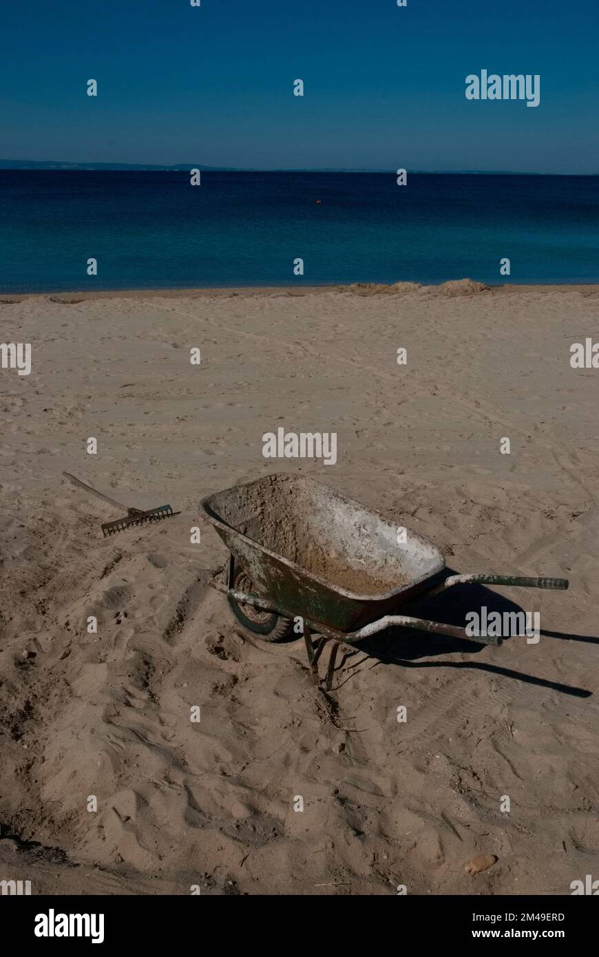 Wheelbarrow on an empty beach Stock Photo - Alamy