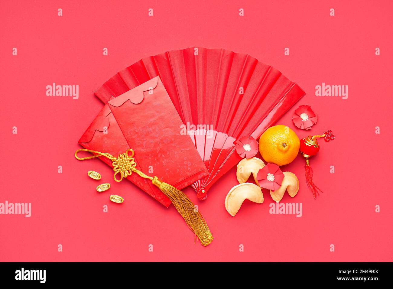 Envelopes, mandarin, fortune cookies and Chinese symbols on red ...