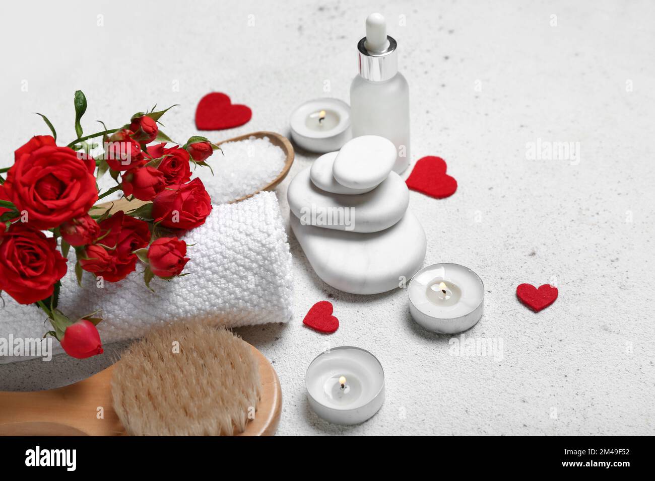 Beautiful spa composition for Valentine's Day with stones, flowers ...