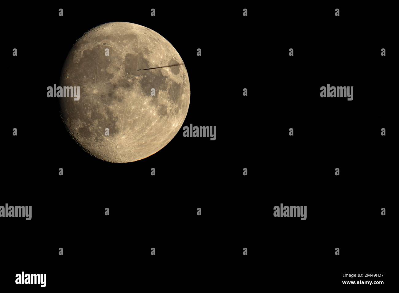 Moon with passing jet, Muensterland, North Rhine Wesphalia, Germany ...