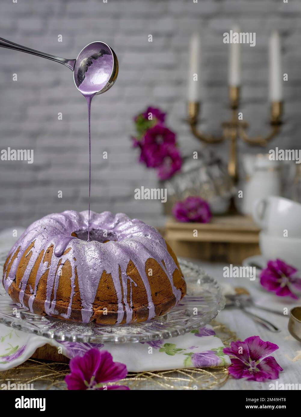 Cake with purple icing, food photography Stock Photo - Alamy