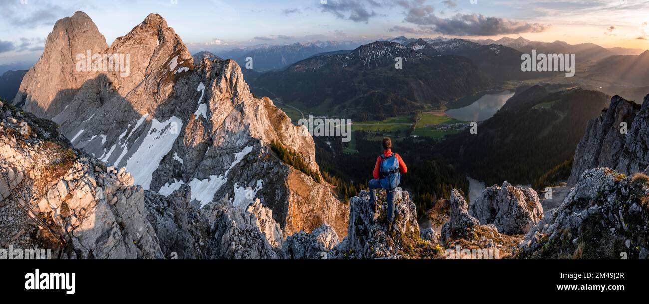 Hikers at the summit of Schartschrofen at sunset, panorama, view of ...