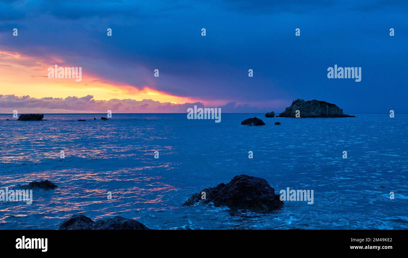 Prasoudi Beach, dusk, sunset, grey clouds, sea, offshore rocky islets ...
