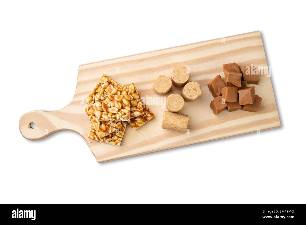 Typical brazilian candies over wooden board. Doce de leite or dulce de ...