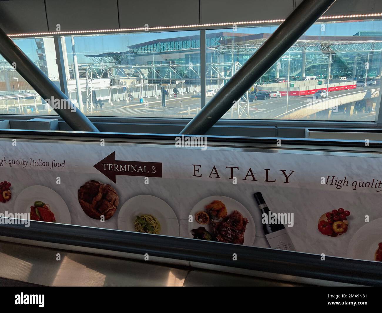 A sign for Eataly directs passengers to its store at Fiumicino airport ...
