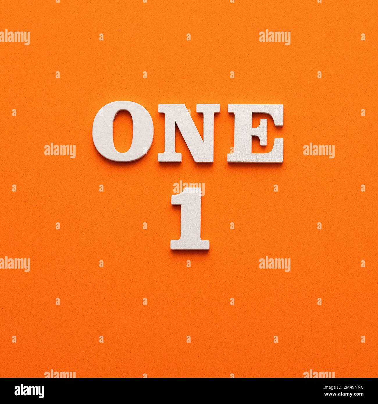 In white letters the word one on an orange background Stock Photo - Alamy