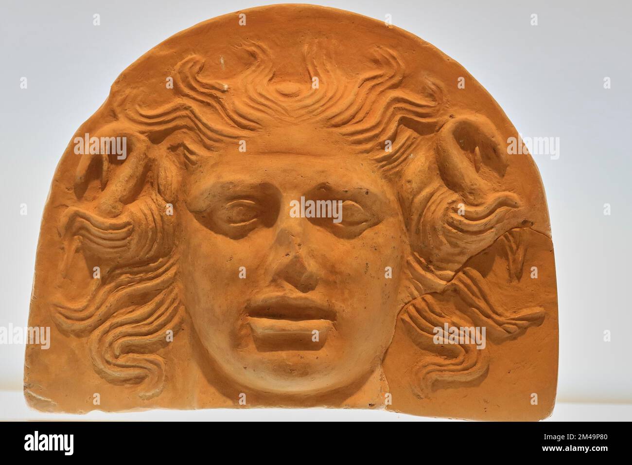 Antefix, complete, frontal tile of a building, head of Medusa, 4th c ...