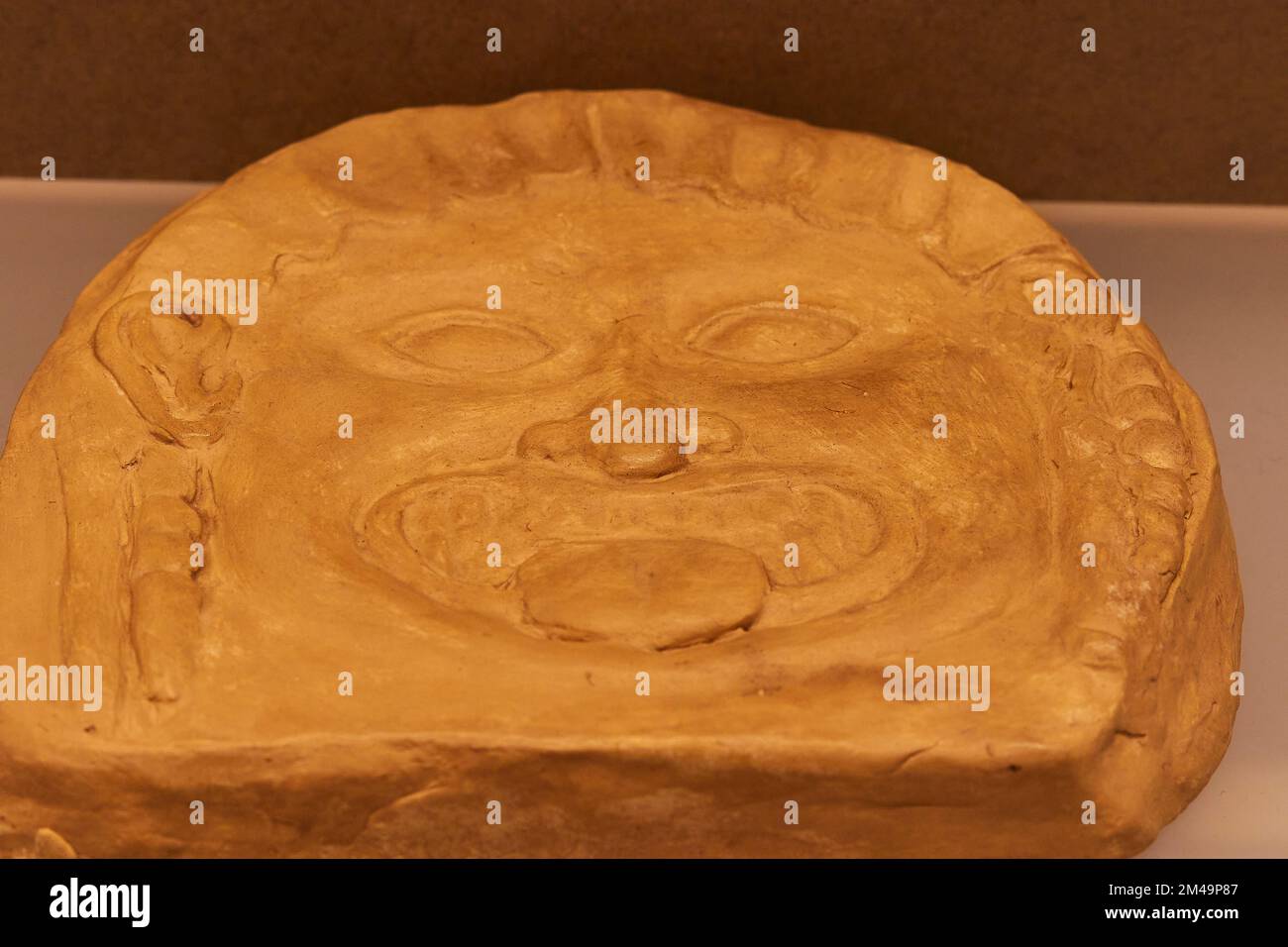 Antefix, frontal tile of a building, head of a gorgoneion, reclining ...