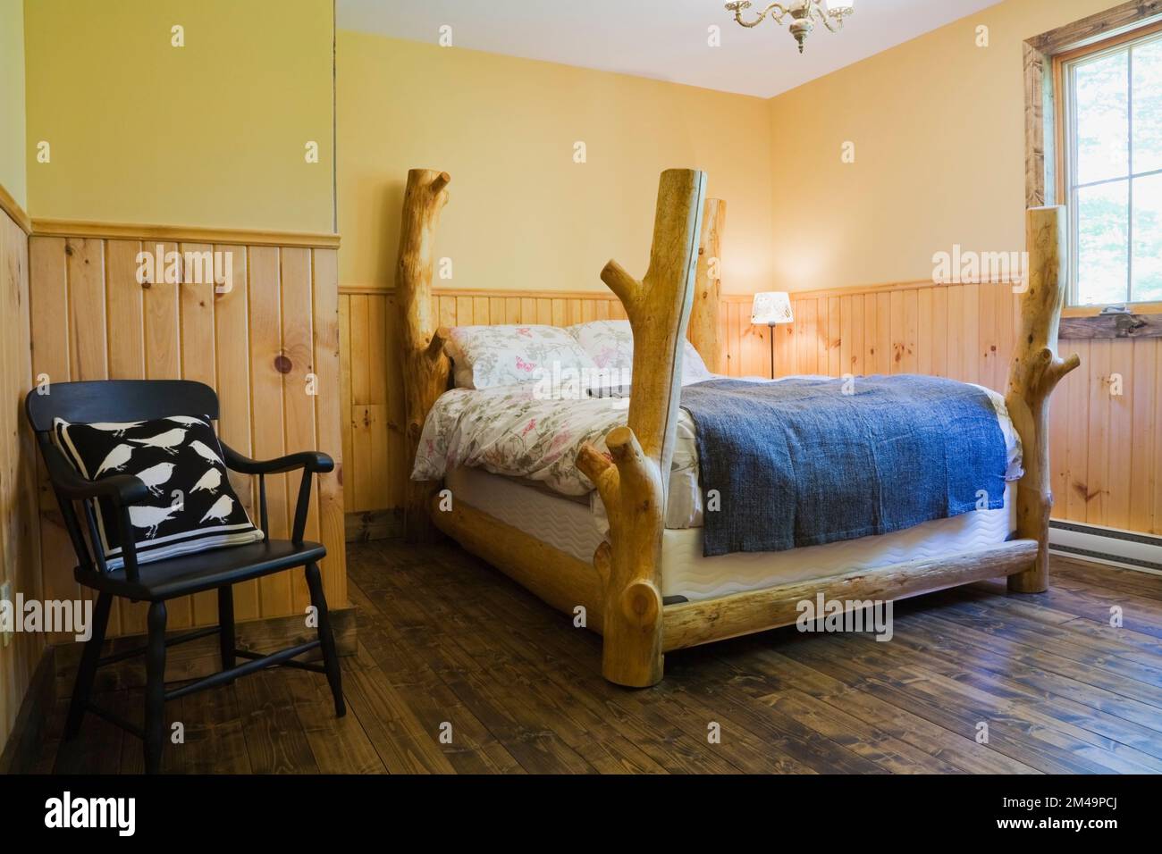 Rustic four poster bed in upstairs guest bedroom with nuanced brown ...