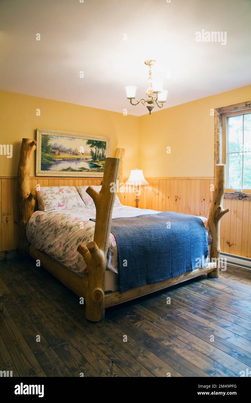 Rustic four poster bed in upstairs guest bedroom with nuanced brown ...